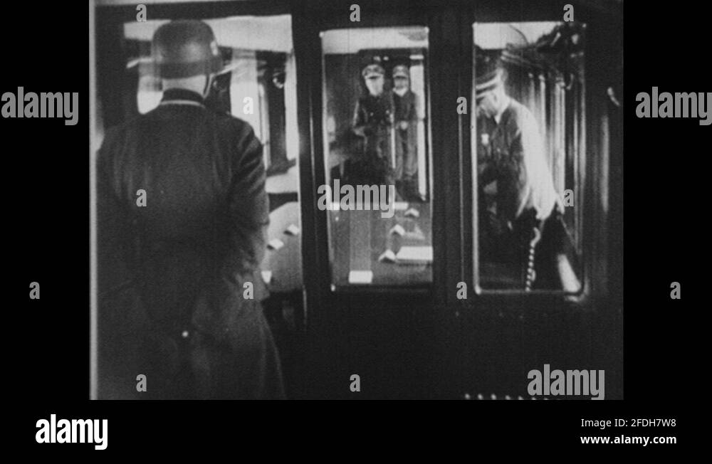 1940s: Nazi soldiers sit down around table in train car. French ...