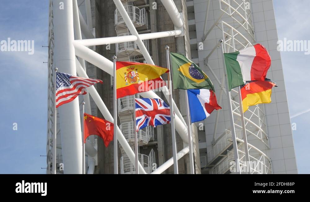 International flags flying in front of Vasco da Gama tower in Lisbon ...