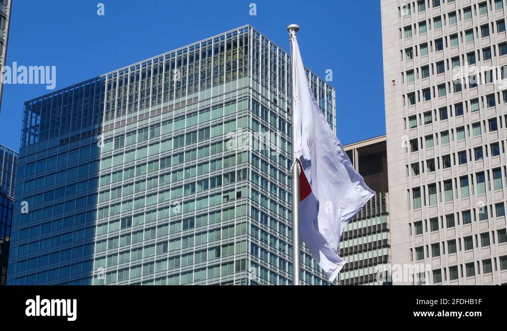 Japan flag with background of modern high-rise building in Tokyo,Japan ...