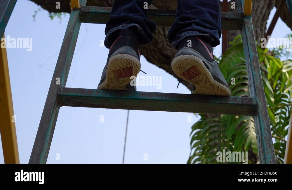 Young woman climbing down ladder Stock Videos & Footage - HD and 4K ...