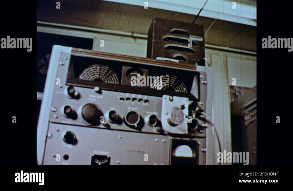 1960s: Recording instruments in a lab. Scientist marks plot points on a ...