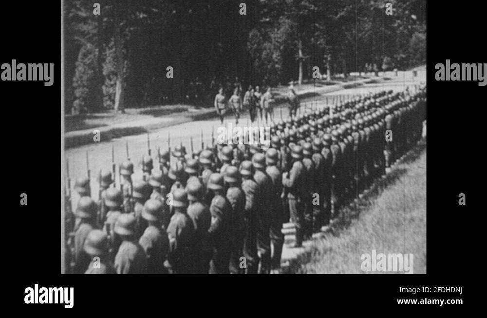 1940s: Hitler marches in front of soldiers standing at attention ...