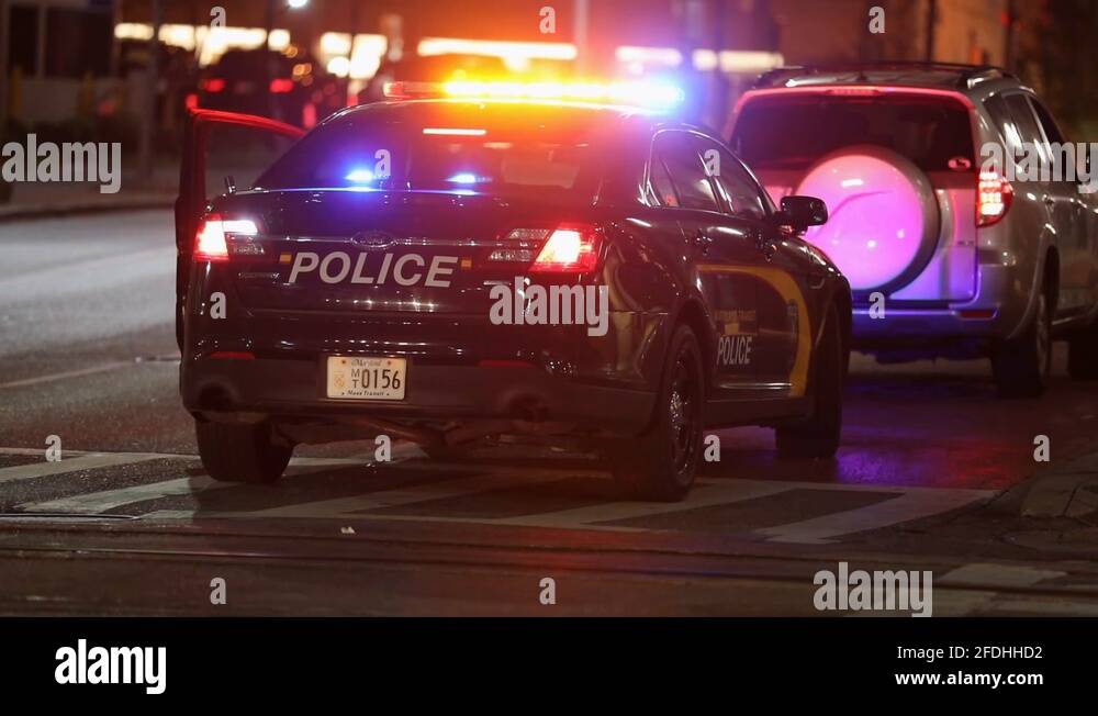 Baltimore City Street and Police Vehicle Lights at Night. Police ...