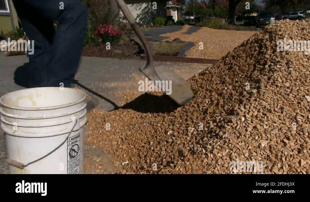 Shoveling rocks Stock Videos & Footage - HD and 4K Video Clips - Alamy