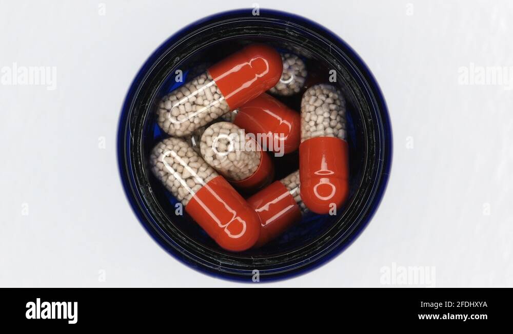 Blue capsules red capsules bottle Stock Videos & Footage - HD and 4K Video Clips - Alamy