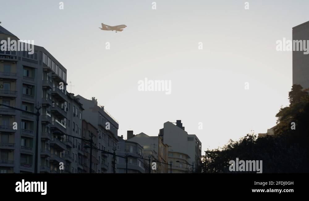 Airplane flying over high buildings Stock Videos & Footage - HD and 4K ...