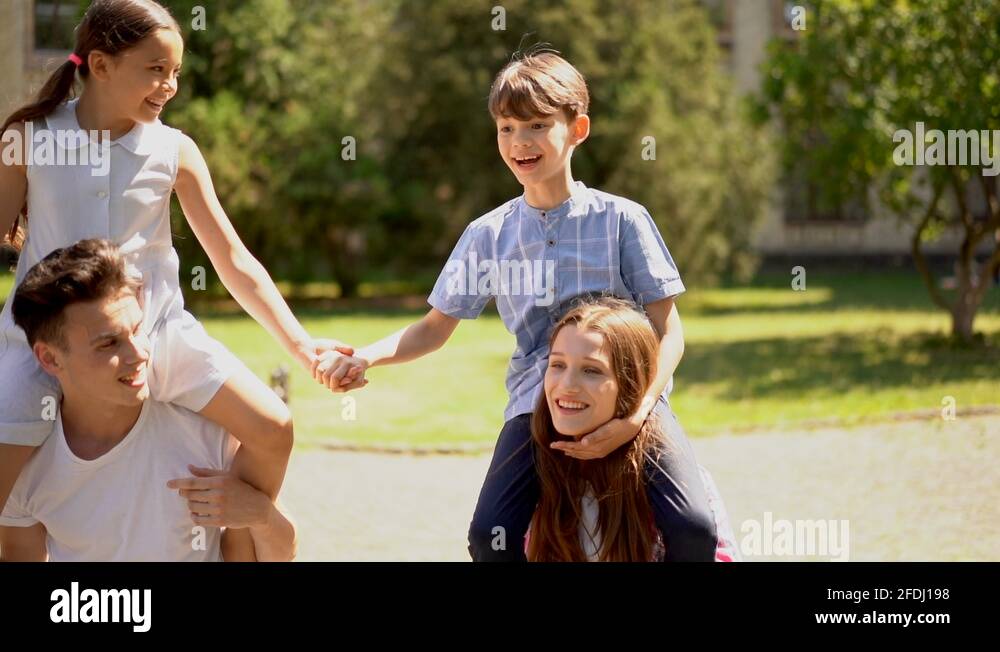 Parents carrying kids on shoulders Stock Videos & Footage - HD and 4K ...