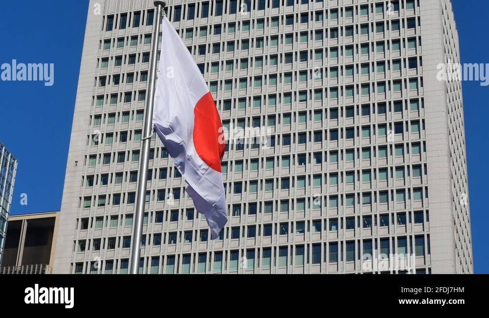 Japan flag with background of modern high-rise building in Tokyo,Japan ...