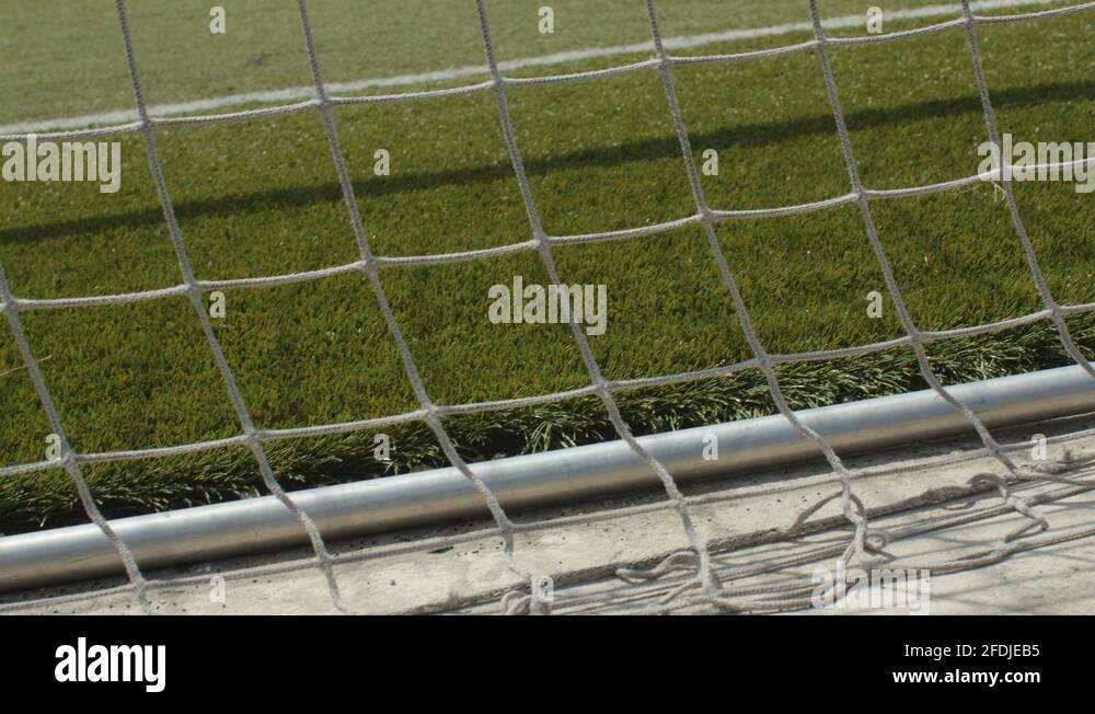 Football Soccer Ball Scores, Turf Field, Back of Net, 4K Stock Video ...