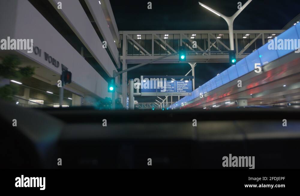 Front Plate of Car Driving Through Los Angeles LAX Airport at Night ...