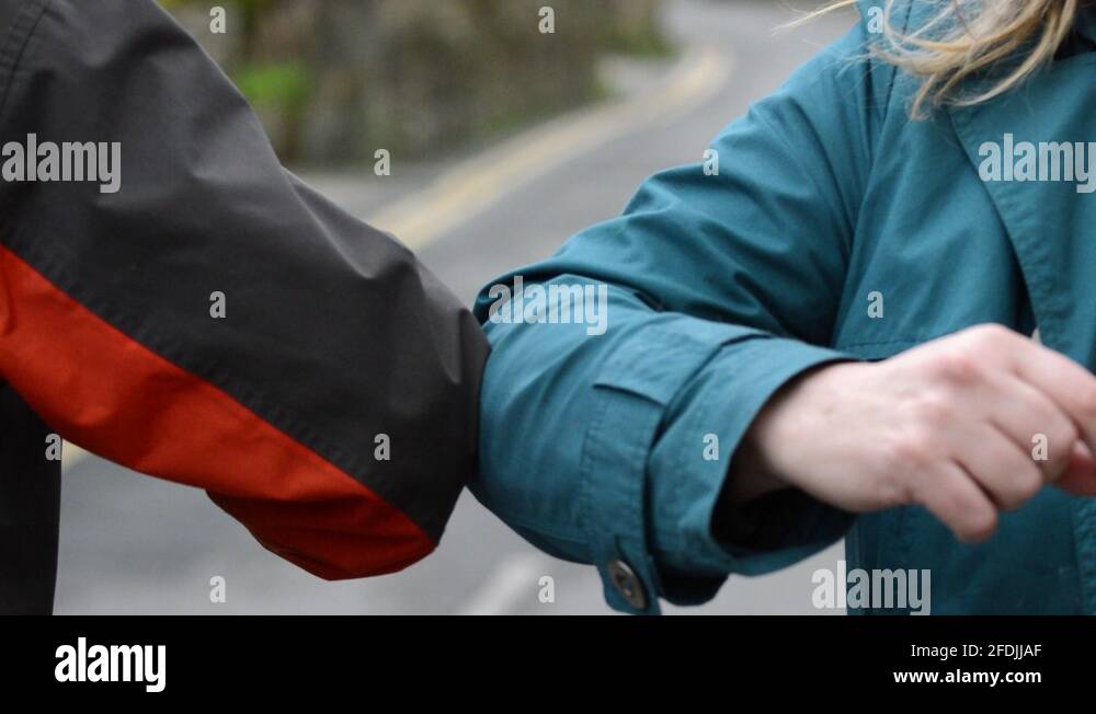 Elbow bump greeting Stock Videos & Footage - HD and 4K Video Clips - Alamy