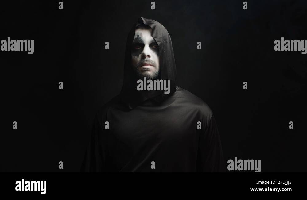 Grim reaper with scary laughing over black background Stock Video ...