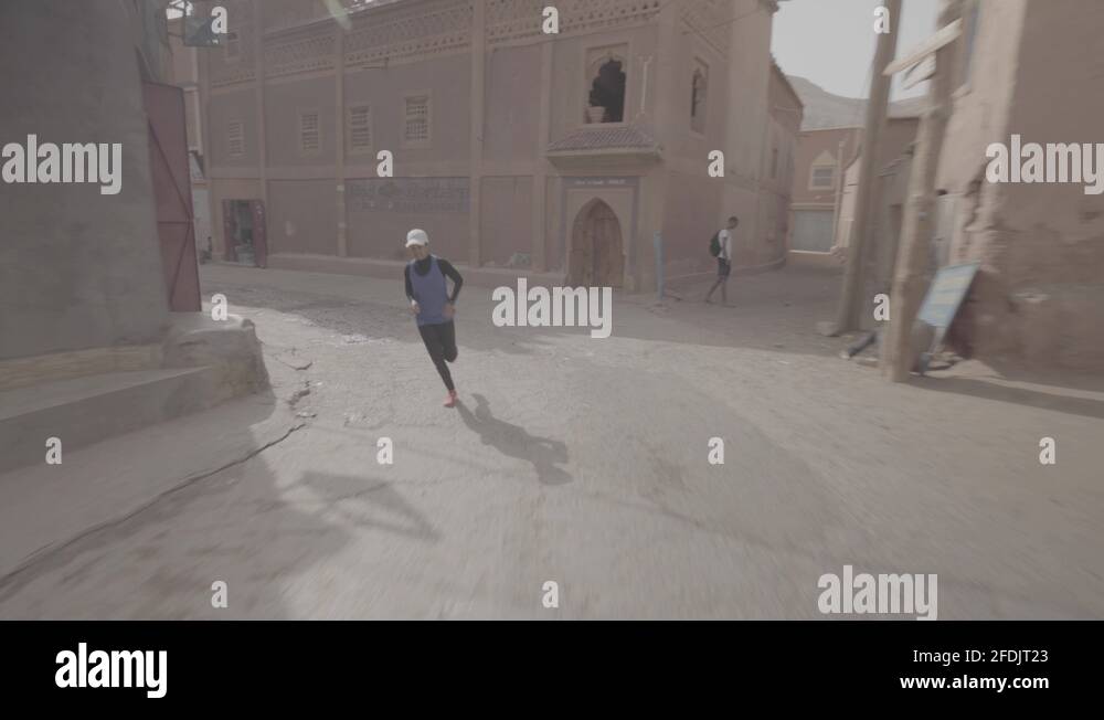 Woman running through the streets Stock Videos & Footage - HD and 4K ...