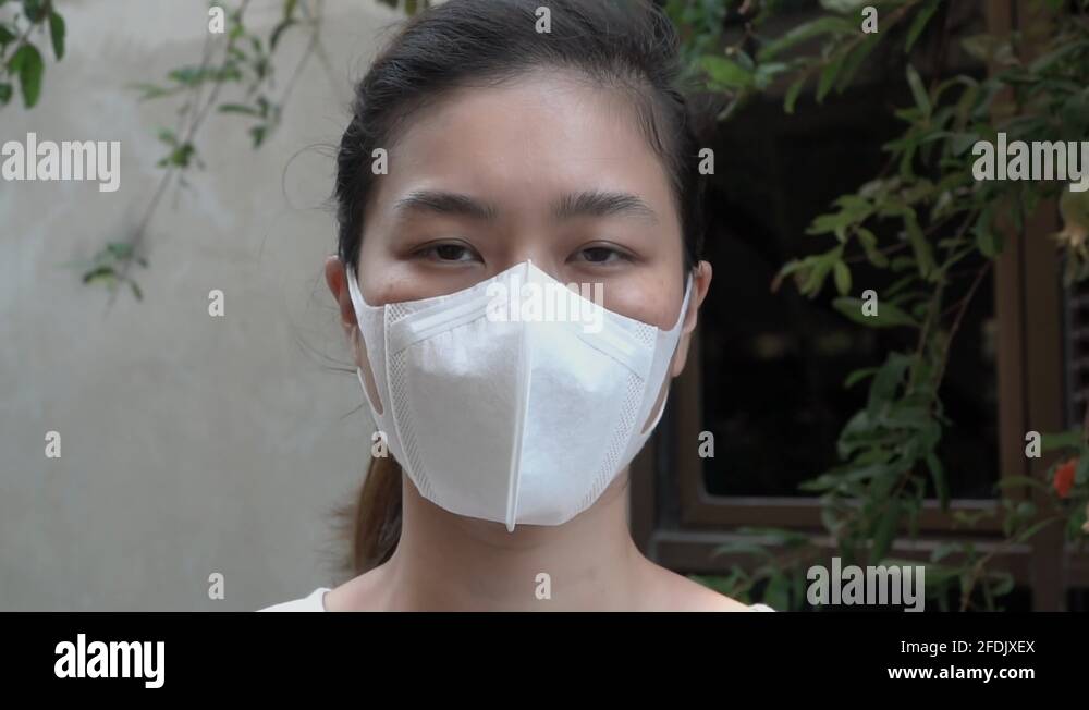 Asian wearing mask Stock Videos & Footage - HD and 4K Video Clips - Alamy