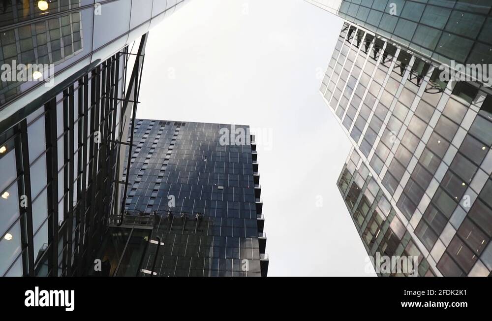action dramatic change of perspective going up revealing high buildings ...