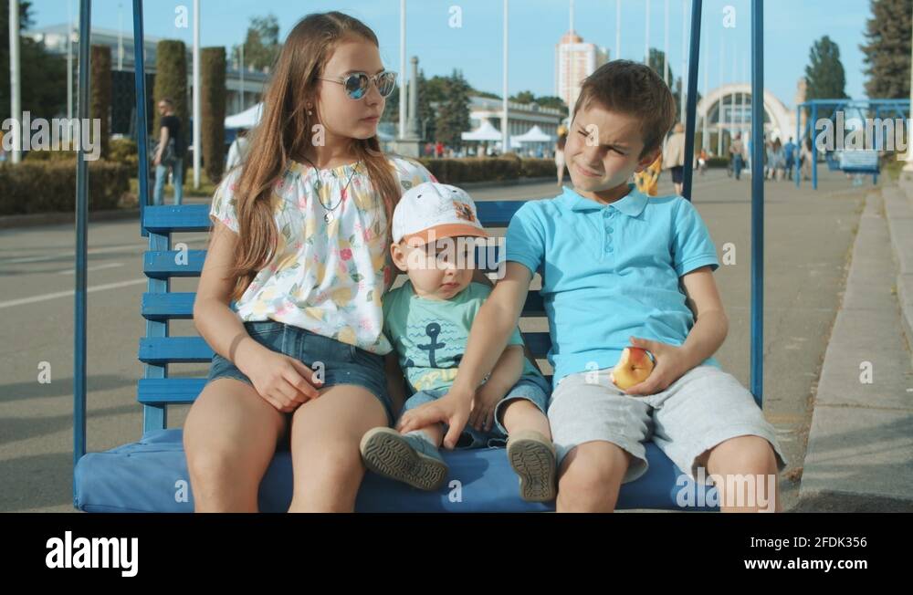 Kids girl sitting outdoors three Stock Videos & Footage - HD and 4K ...