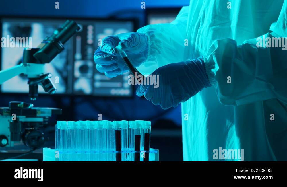 Scientists in protection suit washing hands with antiseptic soap in ...