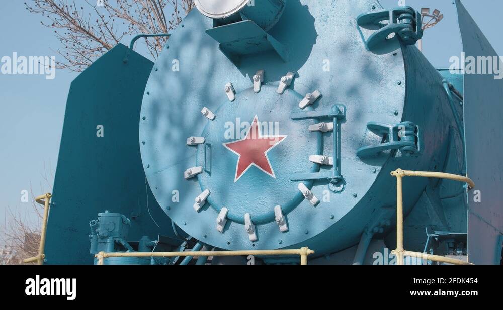 Old blue color steam locomotive train with a red star. Made in USSR ...