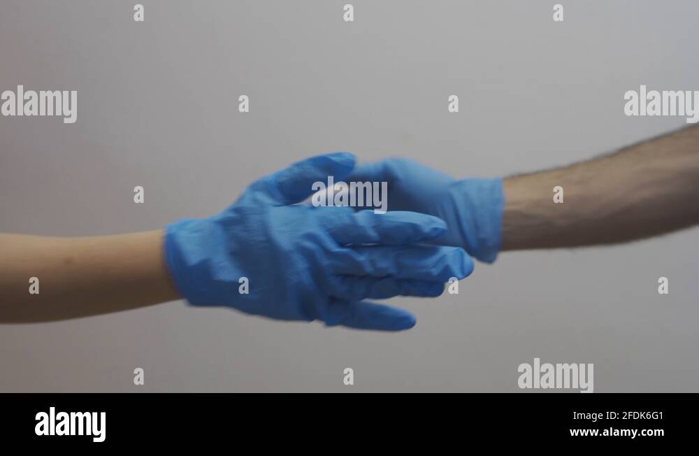 Funny handshake or pound fist bump with latex rubber gloves Stock Video ...