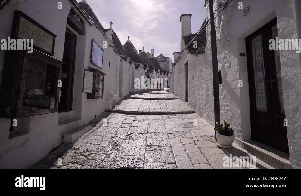 A bright, clean alley by the uniquely designed homes in the peaceful ...