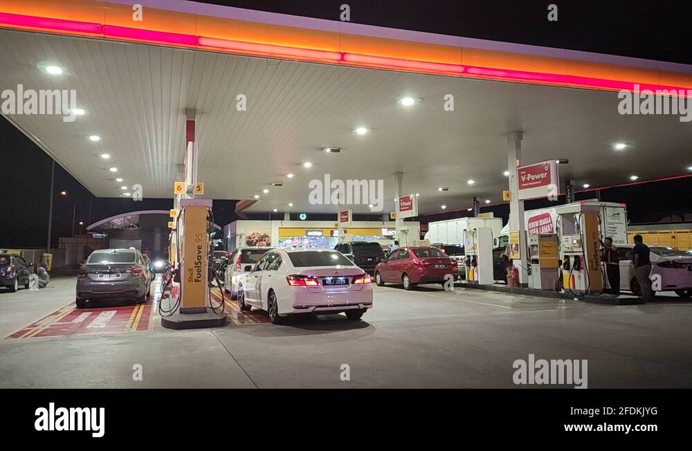 Shell petrol station at night. Customers come to visit this petrol ...