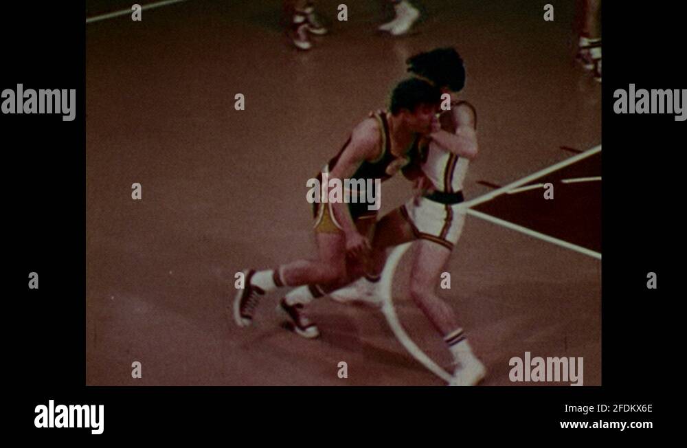1970s: Players bump into each other and commit foul on basketball court ...