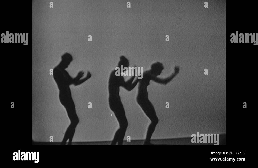 1950s: dancers in shadow pose and jump on stage Stock Video Footage - Alamy