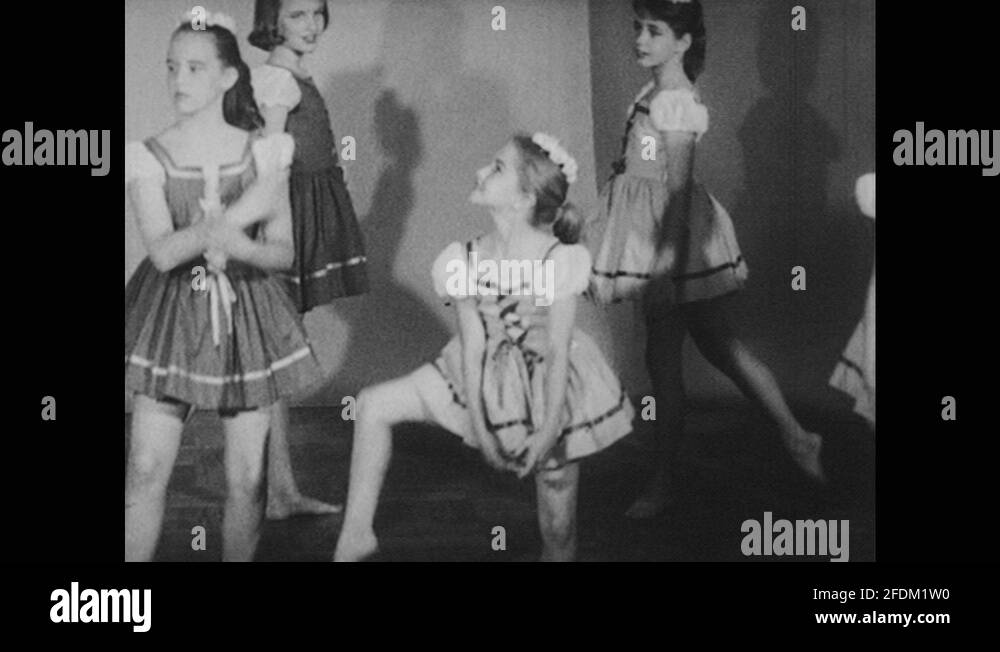 1950s: Views of girls dancing in costume. Wide shot, group of girls ...