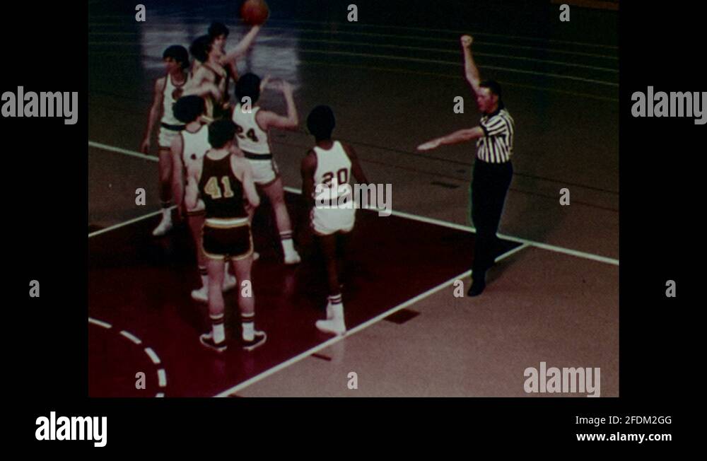 1970s Referee Blows Whistle And Makes Hand Gestures During Basketball Game Stock Video Footage