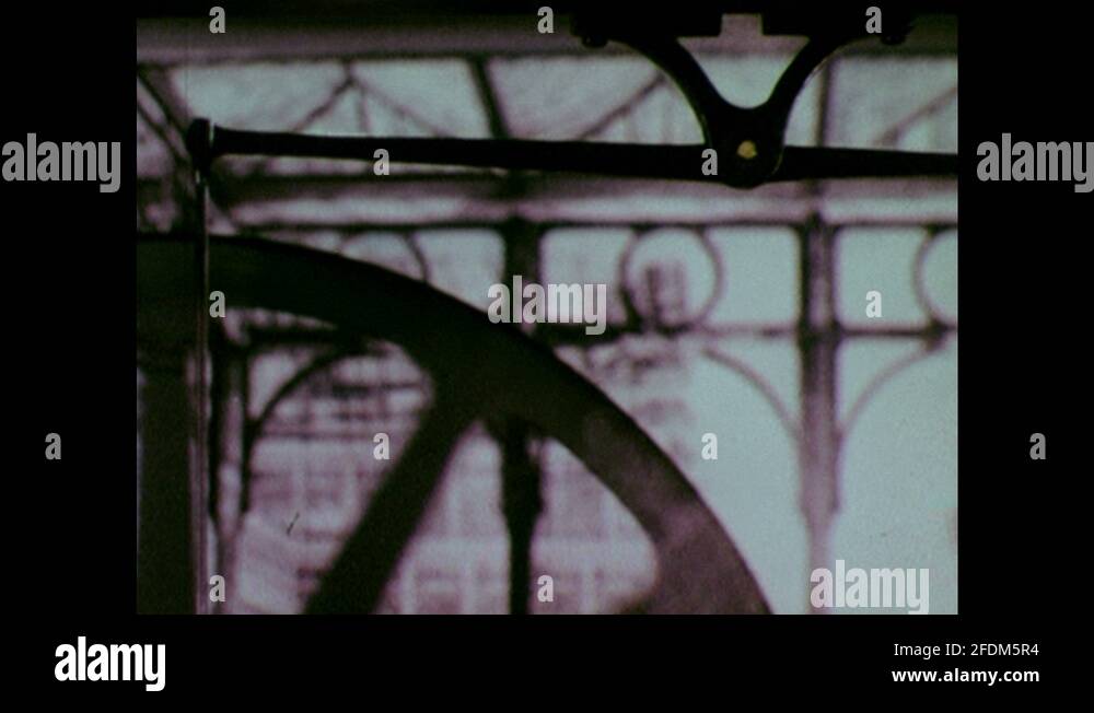 1960s: Parts of machine spin. Animated lines swirl around center line ...