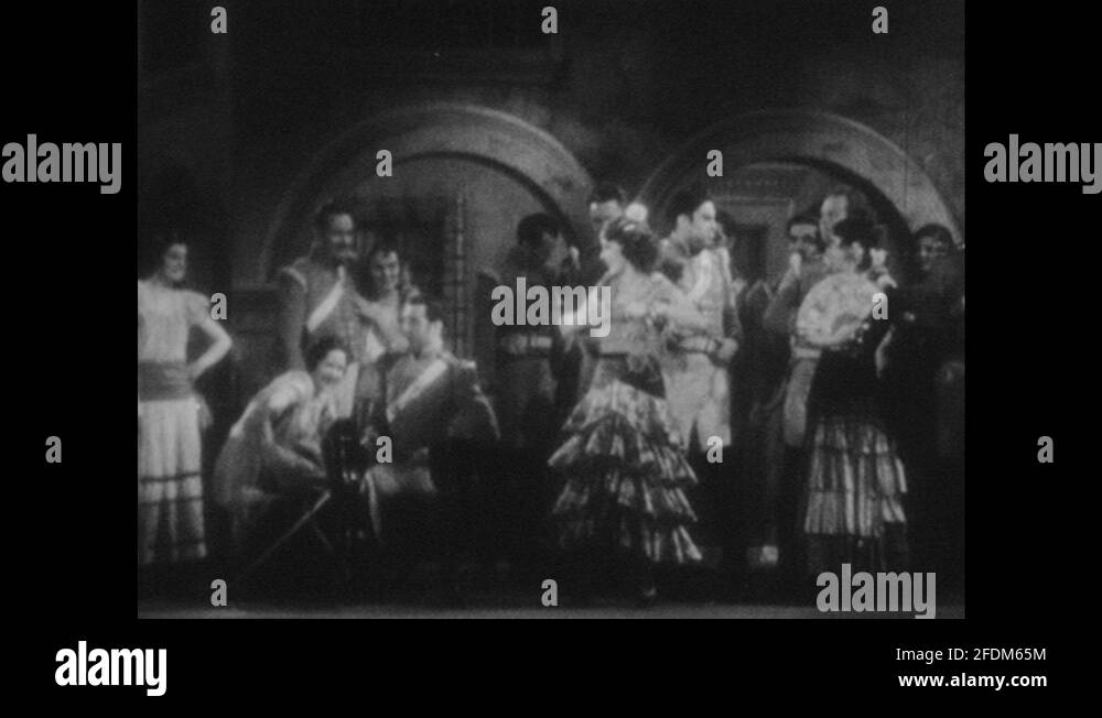 1940s: Carmen dances on the stage singing the Habanera aria as the cast ...