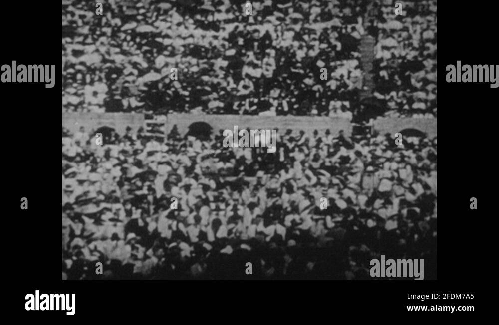 1950s: Crowd of people, President Wilson stands on stage and talks ...