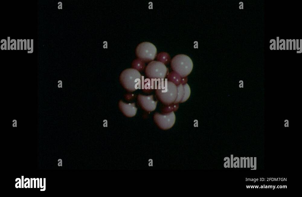 1950s: Cluster of marbles with sticks poking out of it. Microscopic ...