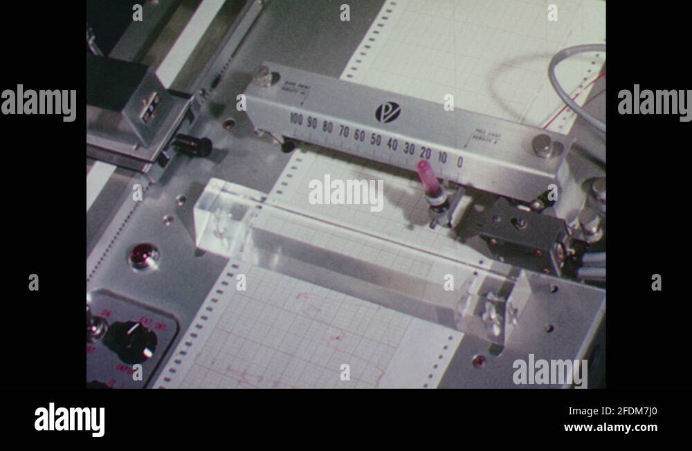 1960s: Recording machine draws lines on graph paper Stock Video Footage ...