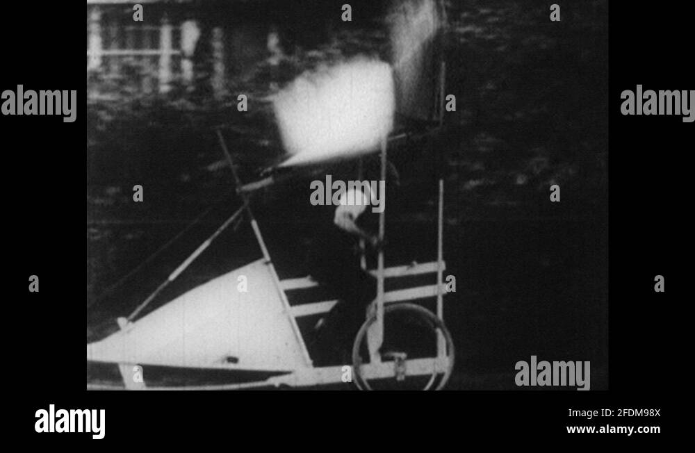 1930s: Man cycles airship with arms flapping wings. Various examples of ...