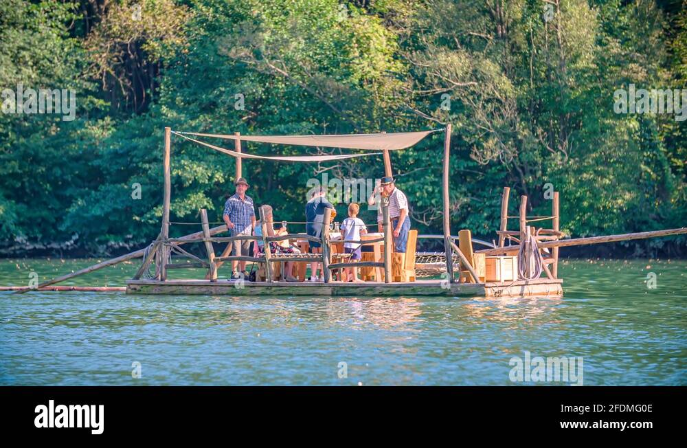 Entire generations of a family have a picnic on a large raft as they ...