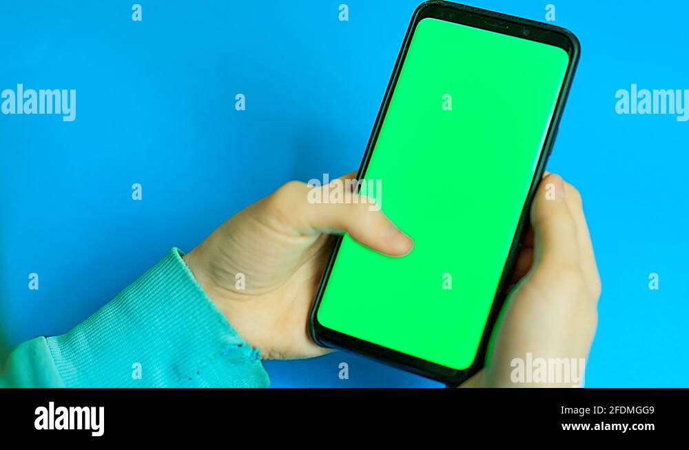 using smart phone with green screen. hands scrolling pages Stock Video ...