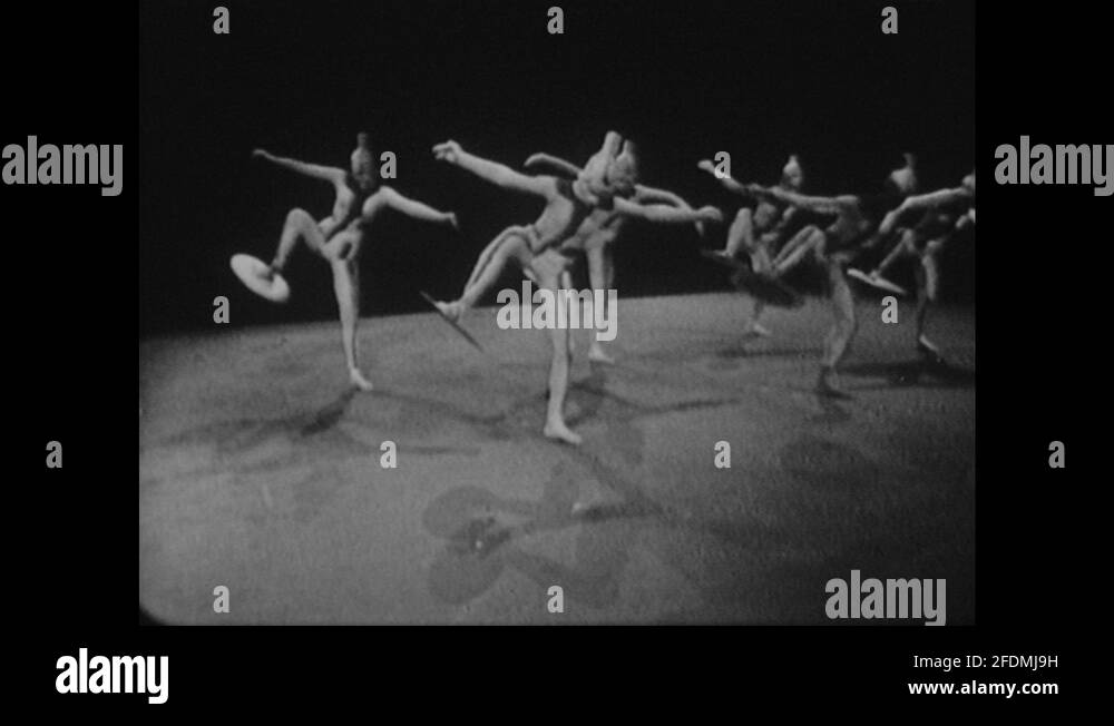 1950s: dancers stand on circles on stage, pose and move, when they lift ...