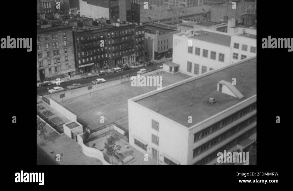 1960s: School building in city. School building in snow. School name on ...