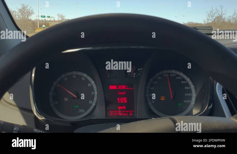 Driving down a highway first person perspective of steering wheel Stock ...
