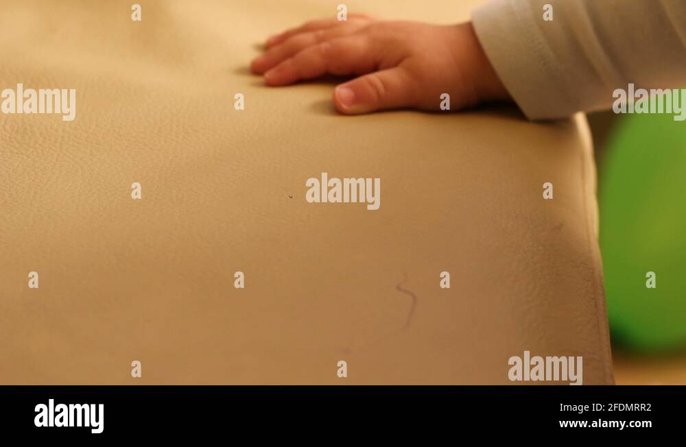 Baby hand takink the decoration heart from his mother hand and throw ...