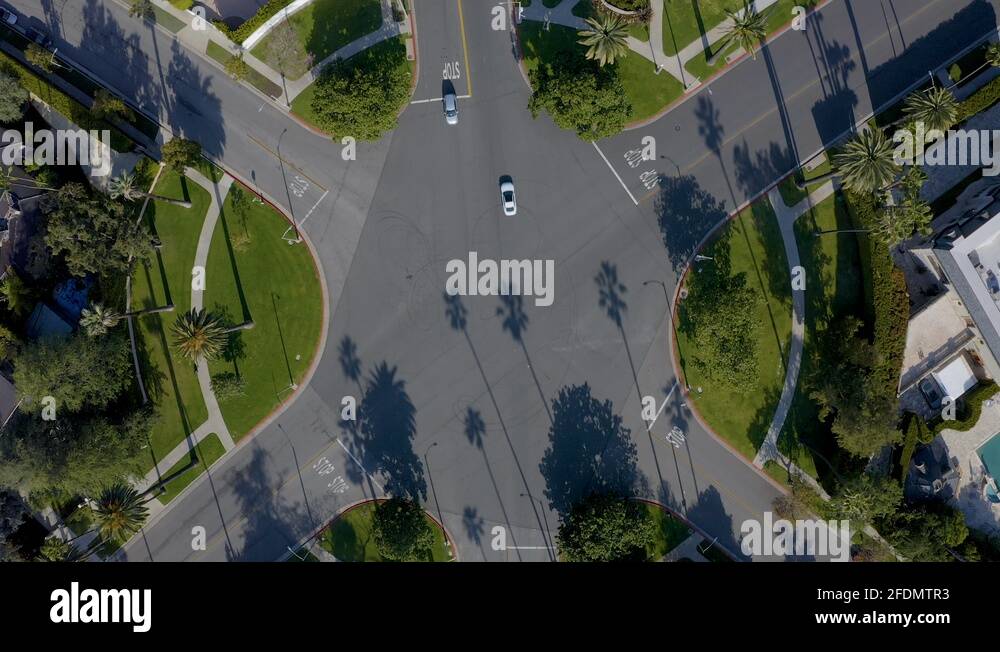Rotating overhead drone shot of 6 point intersection in Beverly Hills ...