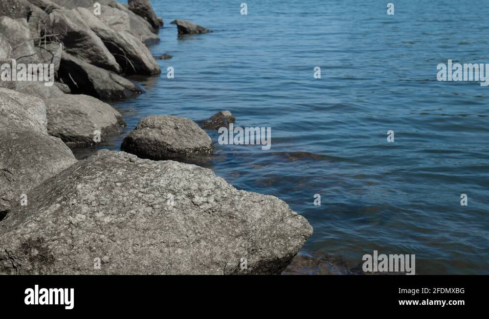 Amphibolite Metamorphic Rock Bed on Lake with Island in Background ...
