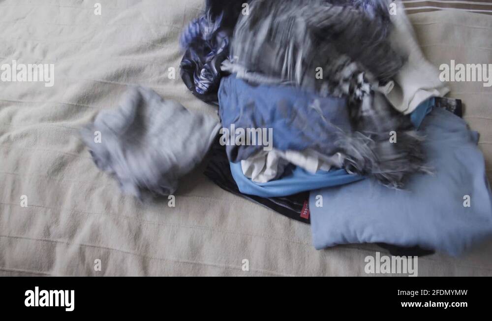 Throwing clothes Stock Videos & Footage - HD and 4K Video Clips - Alamy