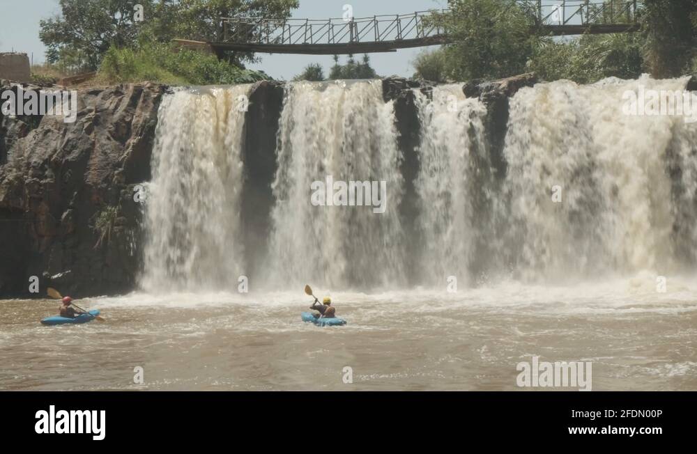 Two men kayaking close to the Sagana river waterfalls in Kenya Stock ...