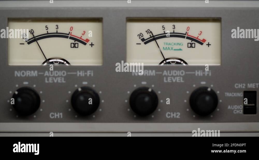 Front panel of a vintage VHS cassette recorder with knobs and volume ...