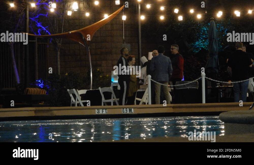 Closeup People Celebrating At An Outdoor Pool Gathering At Night Luxury ...