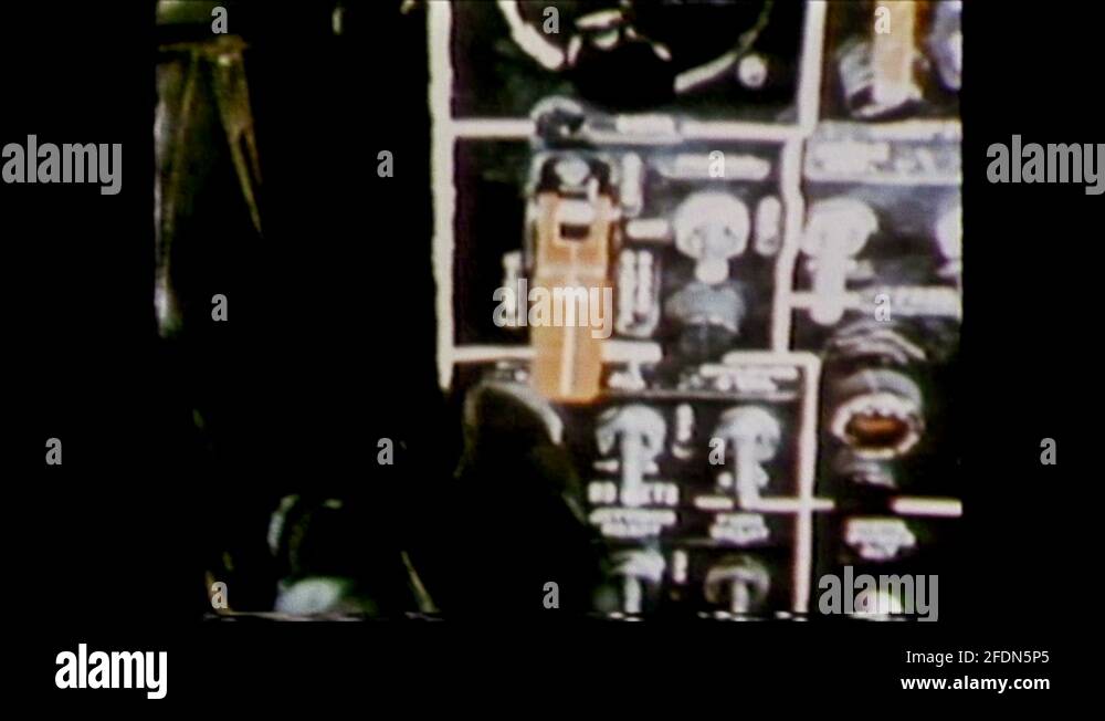 1980s: Pilot flips switch in cockpit. Four airplanes fly in formation ...