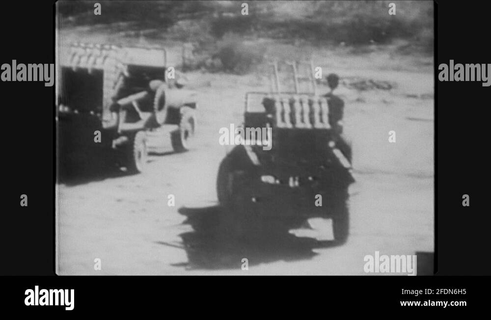 1940s: Jeeps driving with rocket launchers. Rockets firing from jeep ...