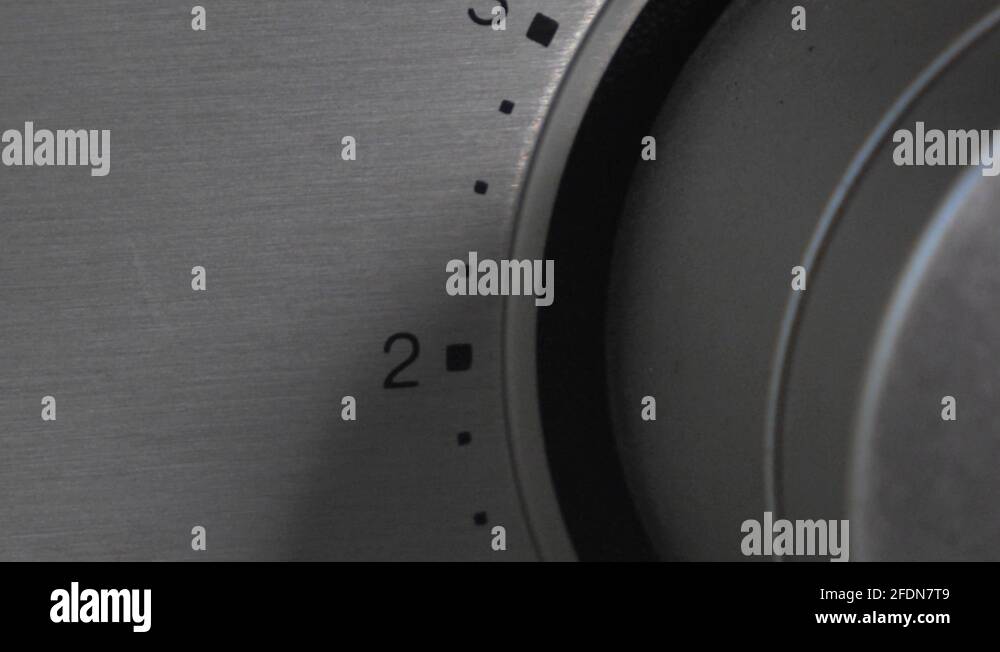Volume dial knob on vintage hifi stereo being turned up with numbers ...